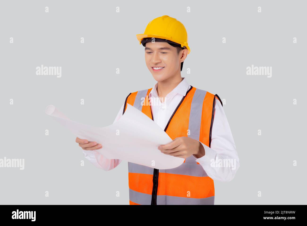 Portrait young asian man is engineer wearing helmet holding and looking ...