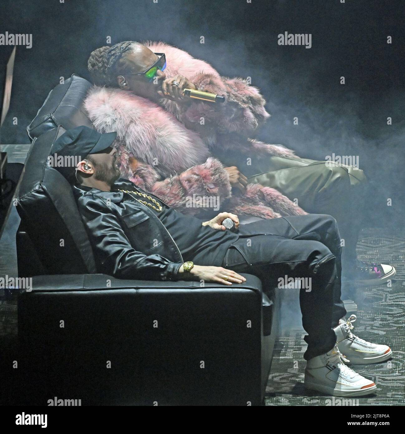 Eminem (left) and Snoop Dogg perform "From the D 2 the LBC" on stage at ...