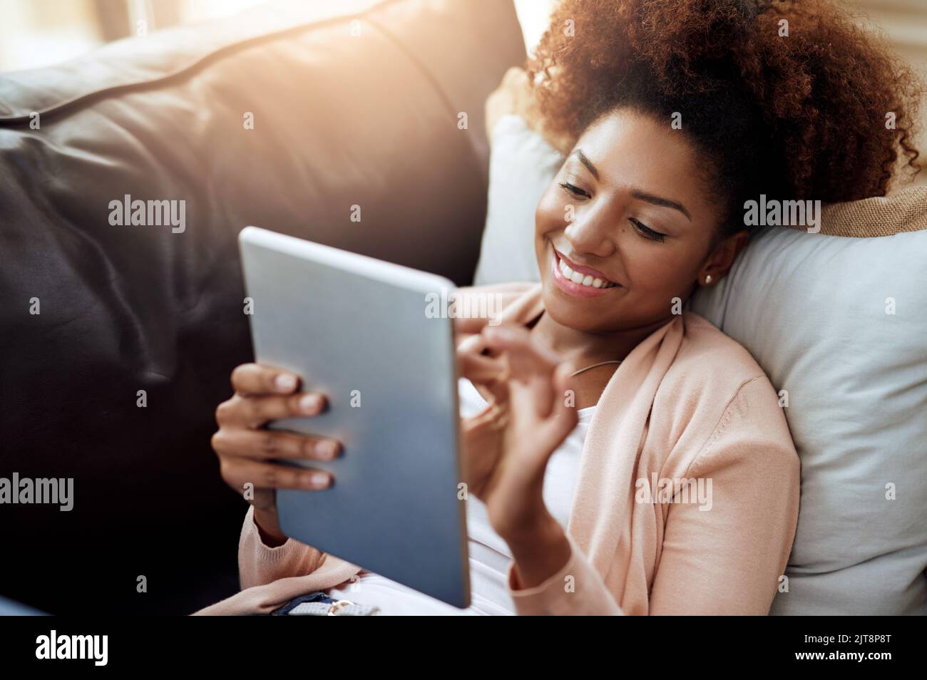 Relaxed young adult sofa hi-res stock photography and images - Alamy