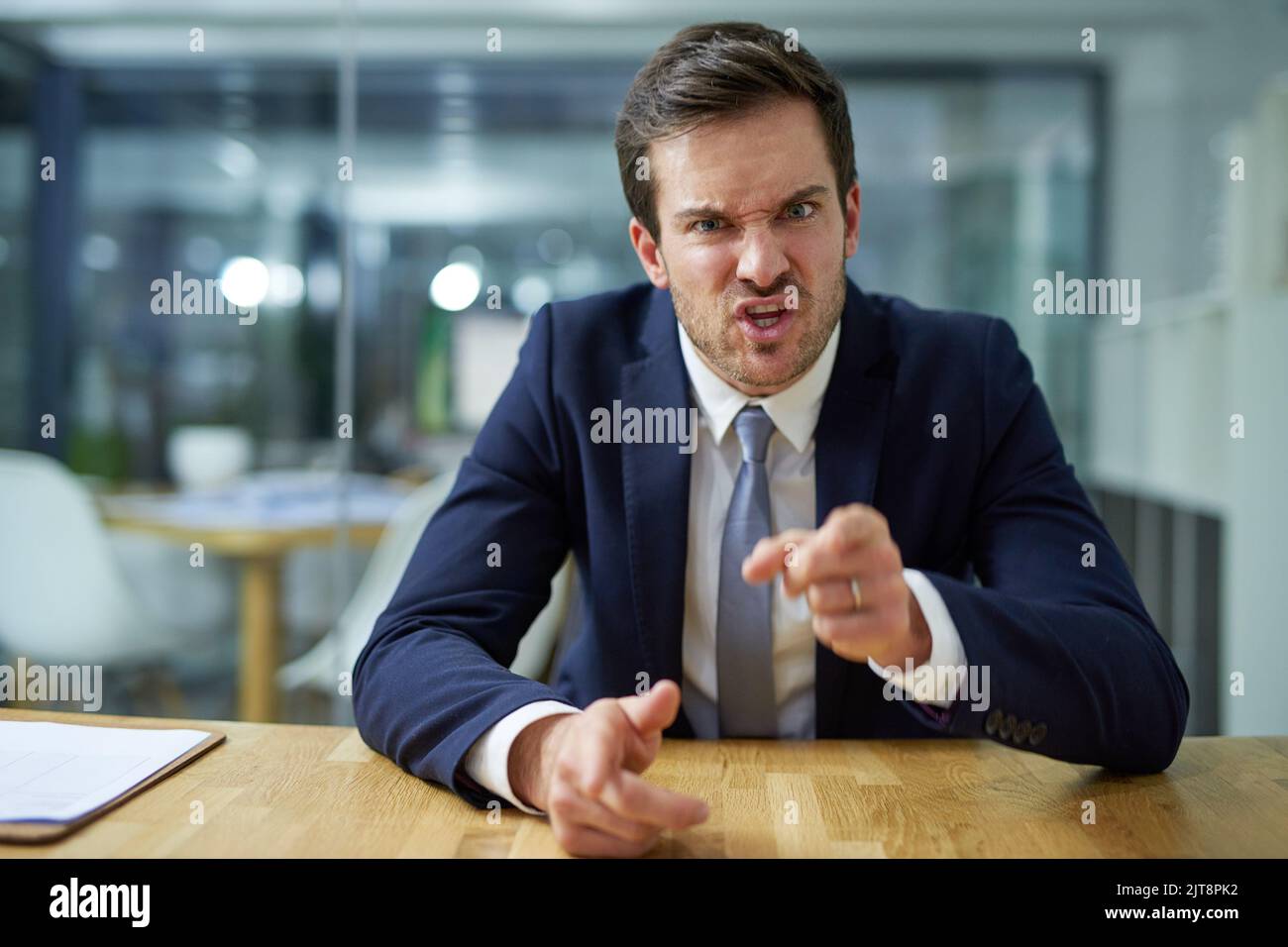 Youre fired. Portrait of an angry businessman shouting and pointing his ...
