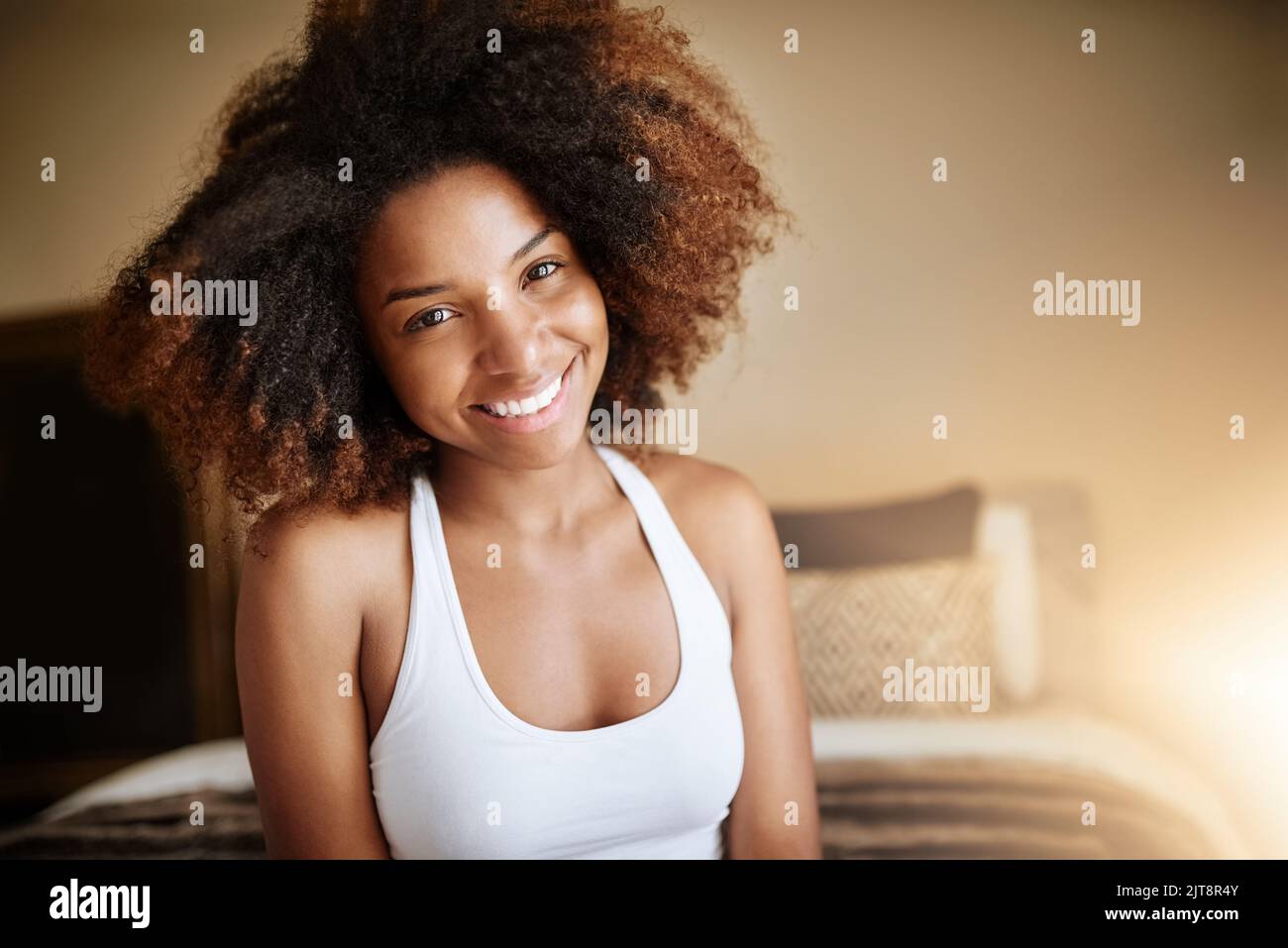 Starting the day on a positive note. Portrait of a happy young woman ...