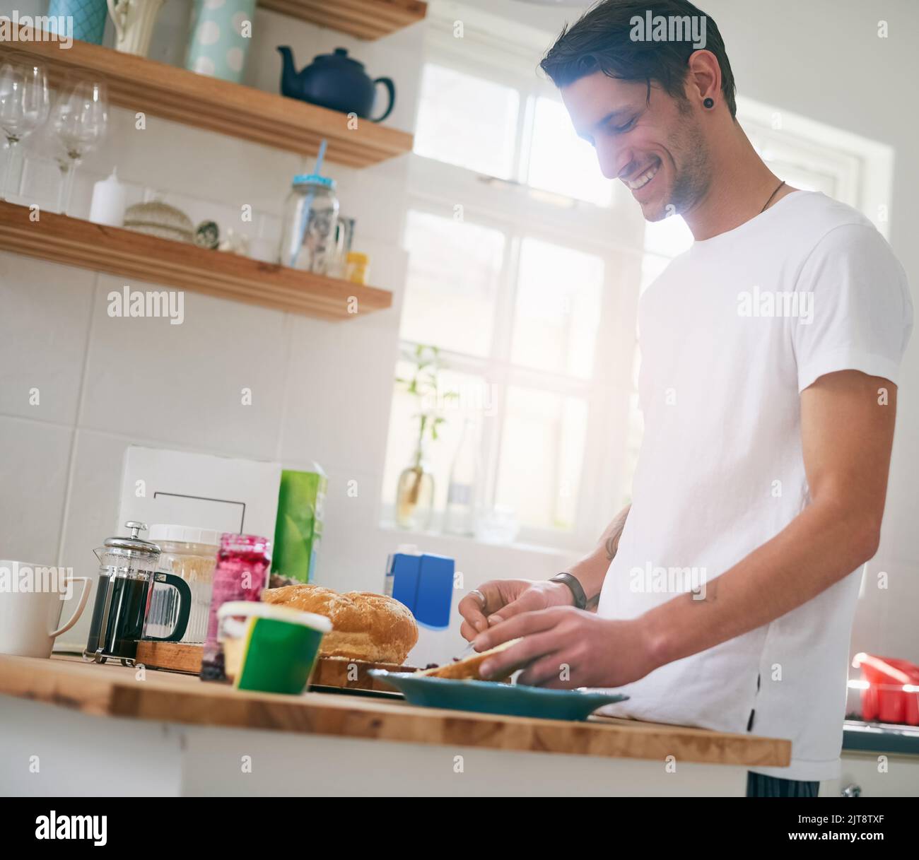 Young adult making sandwich kitchen hi-res stock photography and images ...