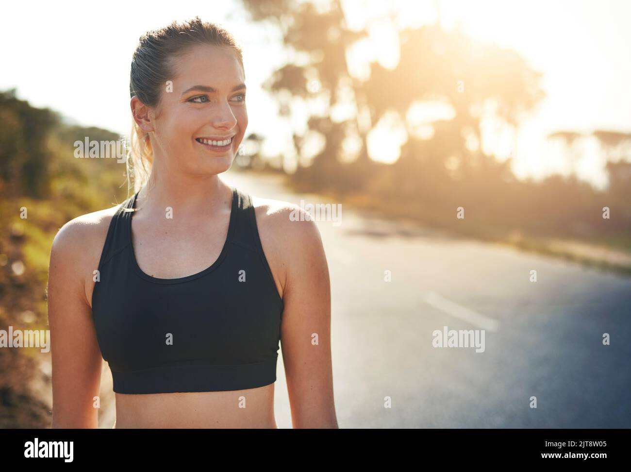 Awesome day for an awesome workout. a young runner training outdoors ...