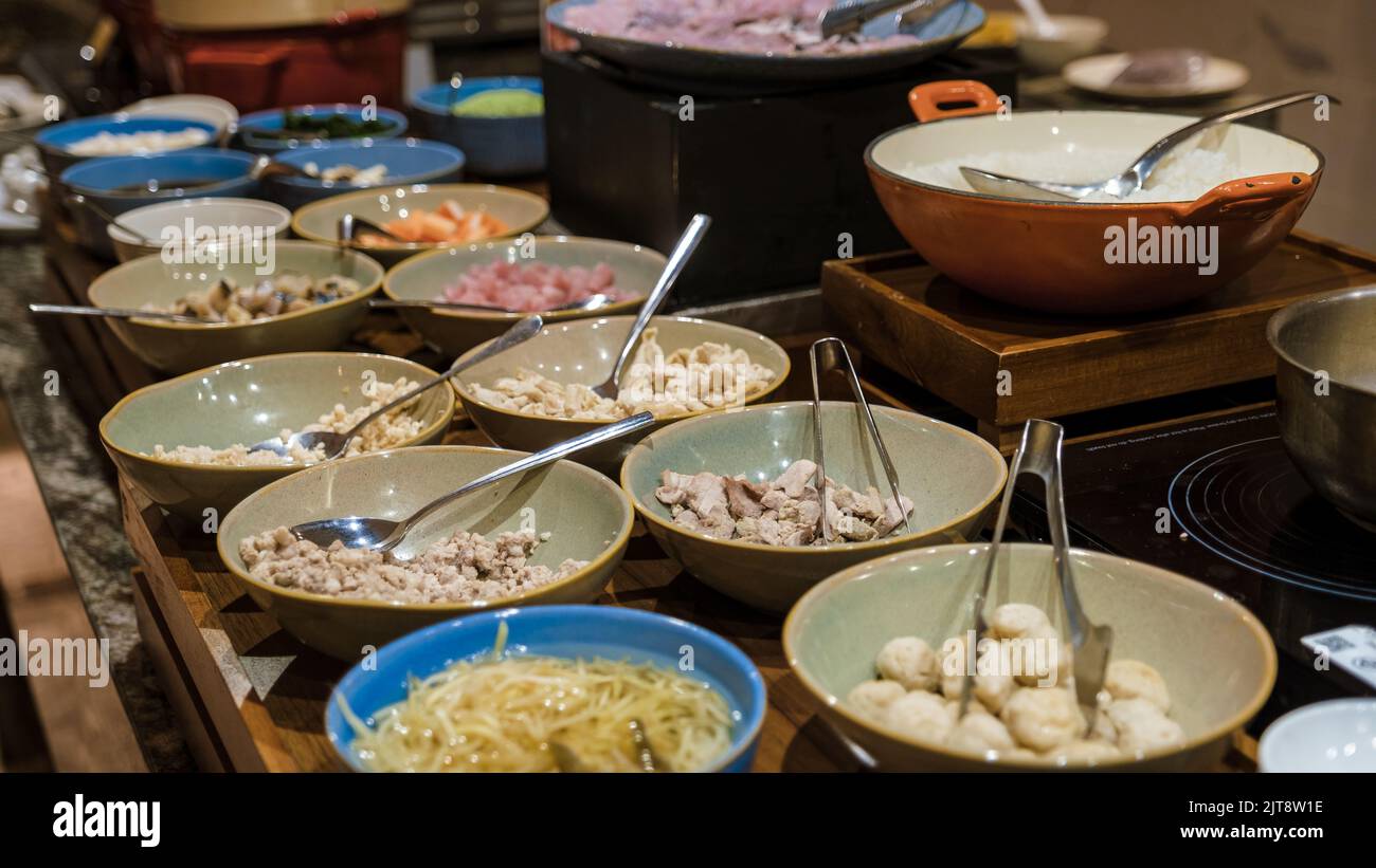 Breakfast buffet in a luxury hotel. Japanese corner with sushi and ...