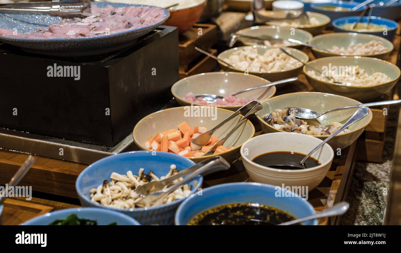 Breakfast buffet in a luxury hotel. Japanese corner with sushi and ...