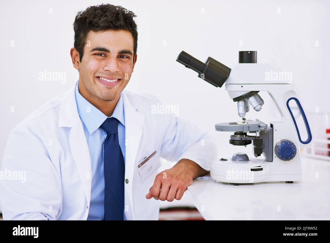 Research is its own reward. Portrait of a smiling lab technician using ...