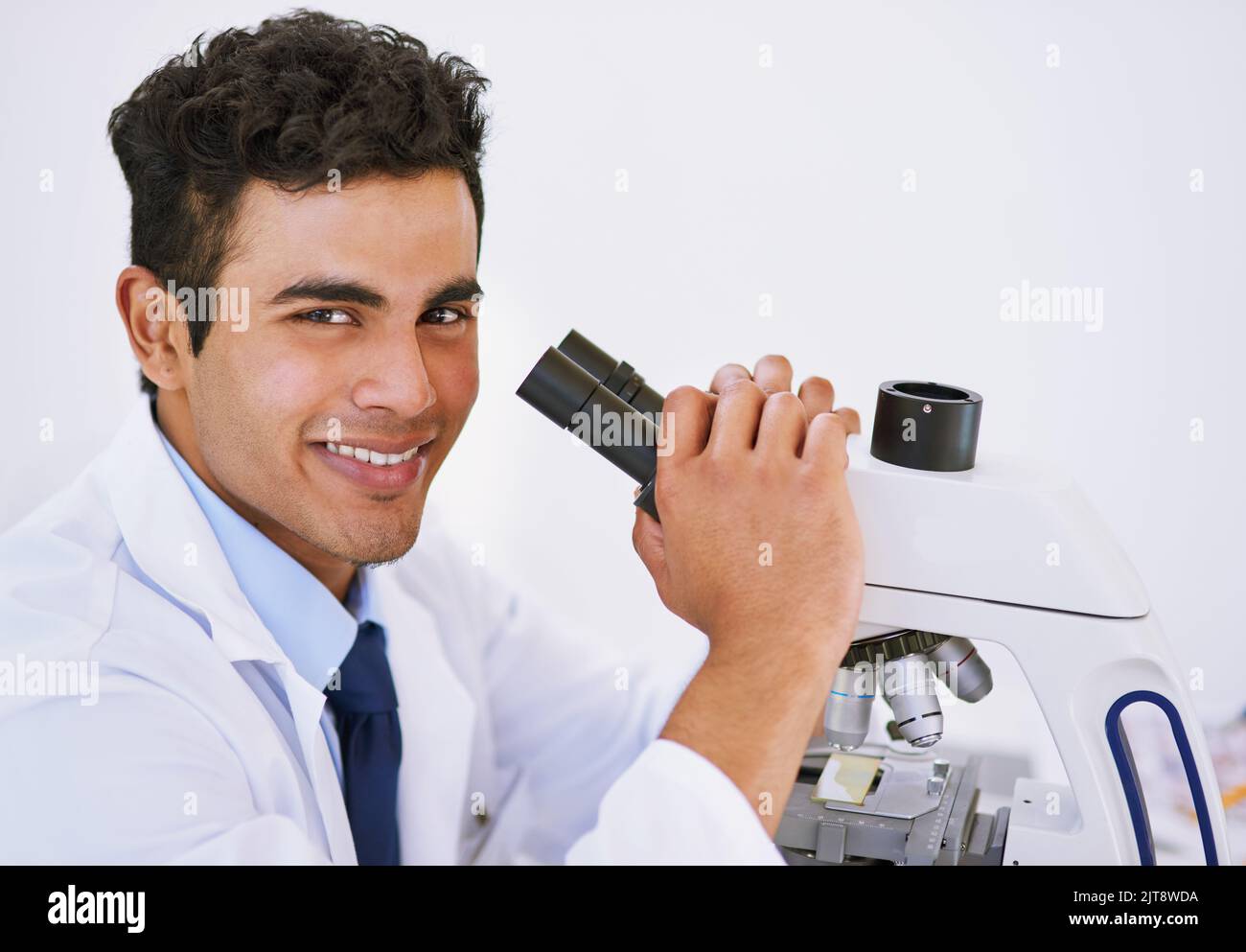 Getting results in the lab. Portrait of a smiling lab technician using ...