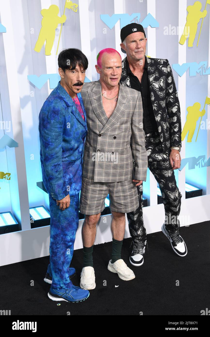 The Red Hot Chili Peppers, vocalist Anthony Kiedis, bassist Flea, and ...
