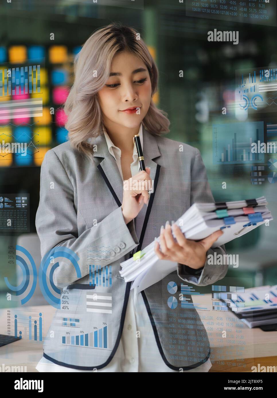 Young asian woman watching interface innovative Business technology on ...