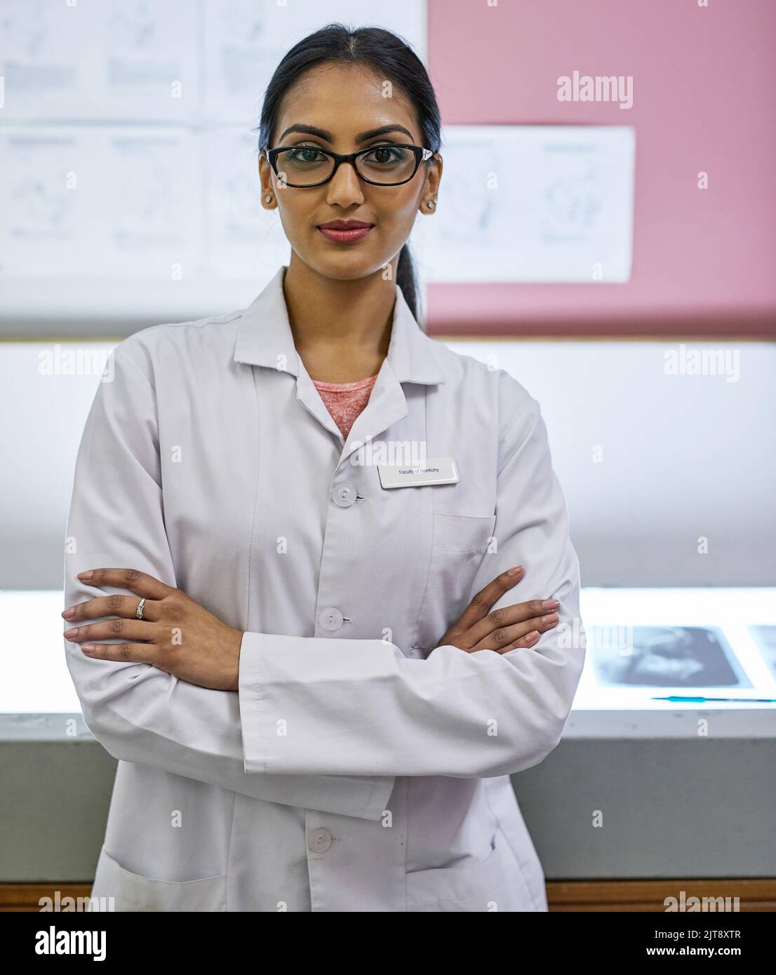 Shell take care of your teeth. Portrait of a young female dentist ...