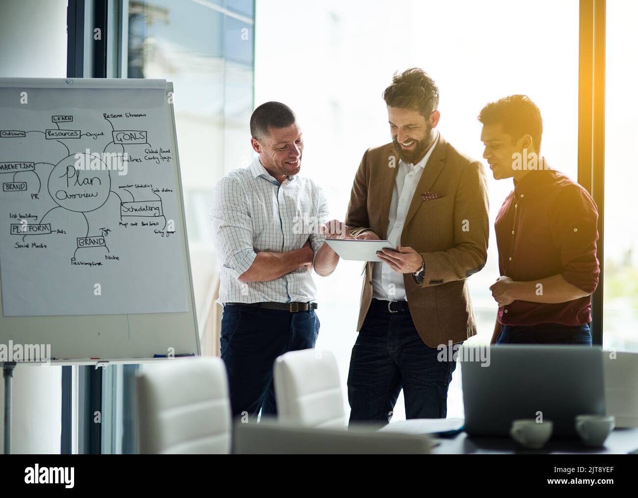 Tapping into business transformation together. a group of colleagues ...