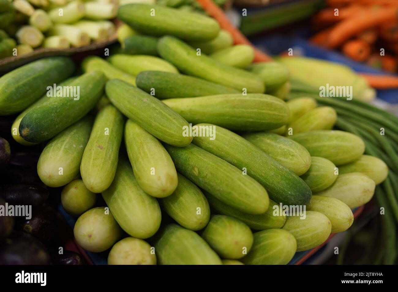 Pile of fresh cucumbers in traditional market Stock Photo - Alamy