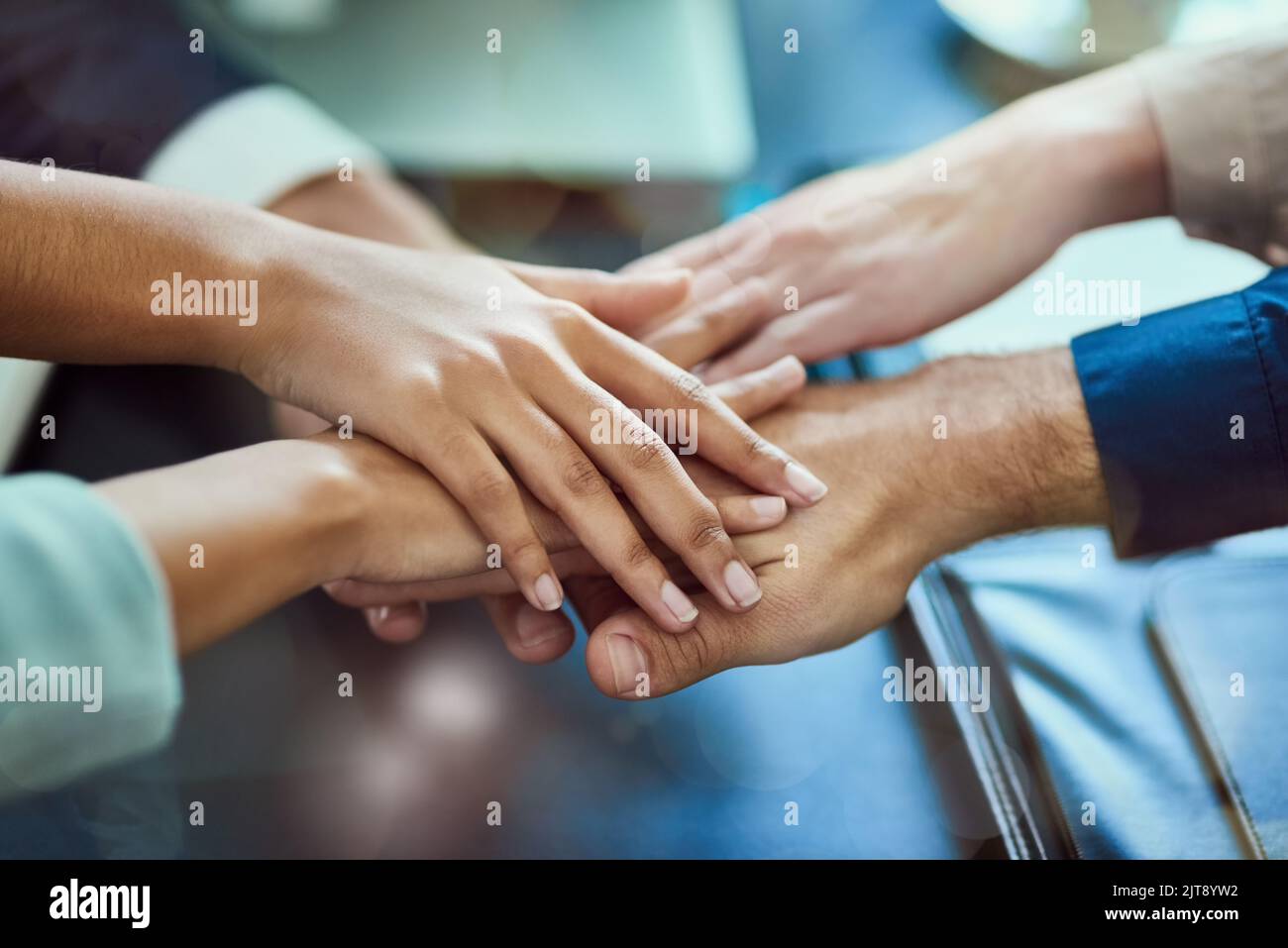 United for the teams success. Closeup shot of a group of executives ...