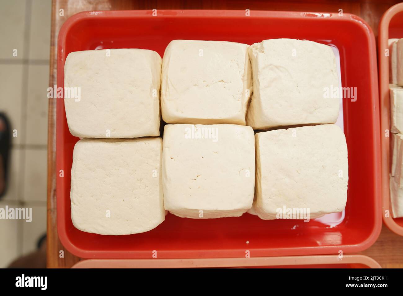 Raw white tofu in red baskets sold in traditional markets Top View ...