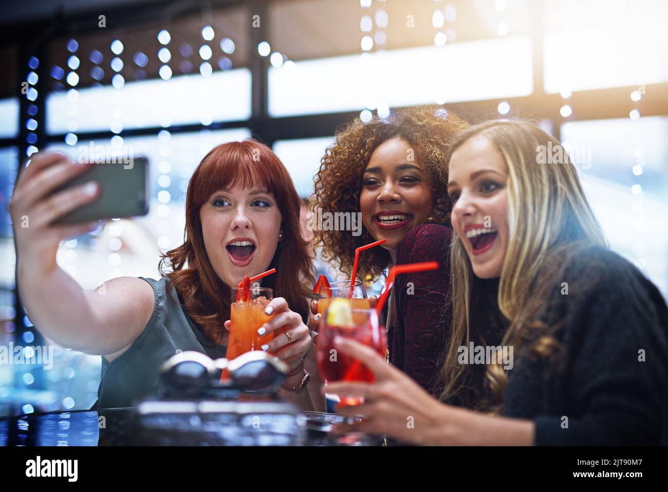 Weve got to get a pic together. a group of friends taking a selfie ...