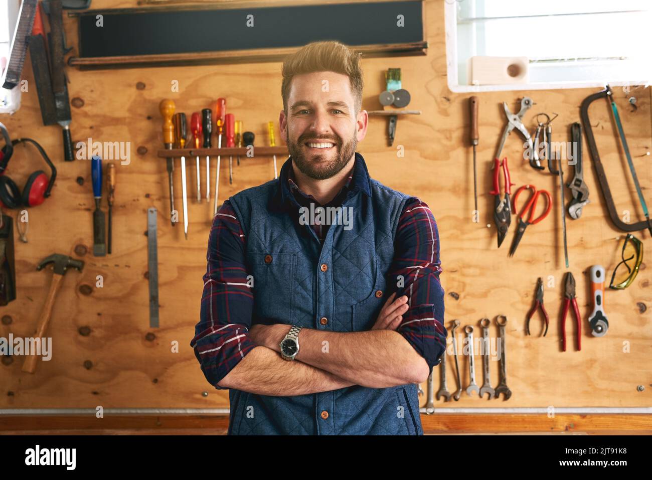 Trust me, I can build it. Portrait of a handsome young handyman ...