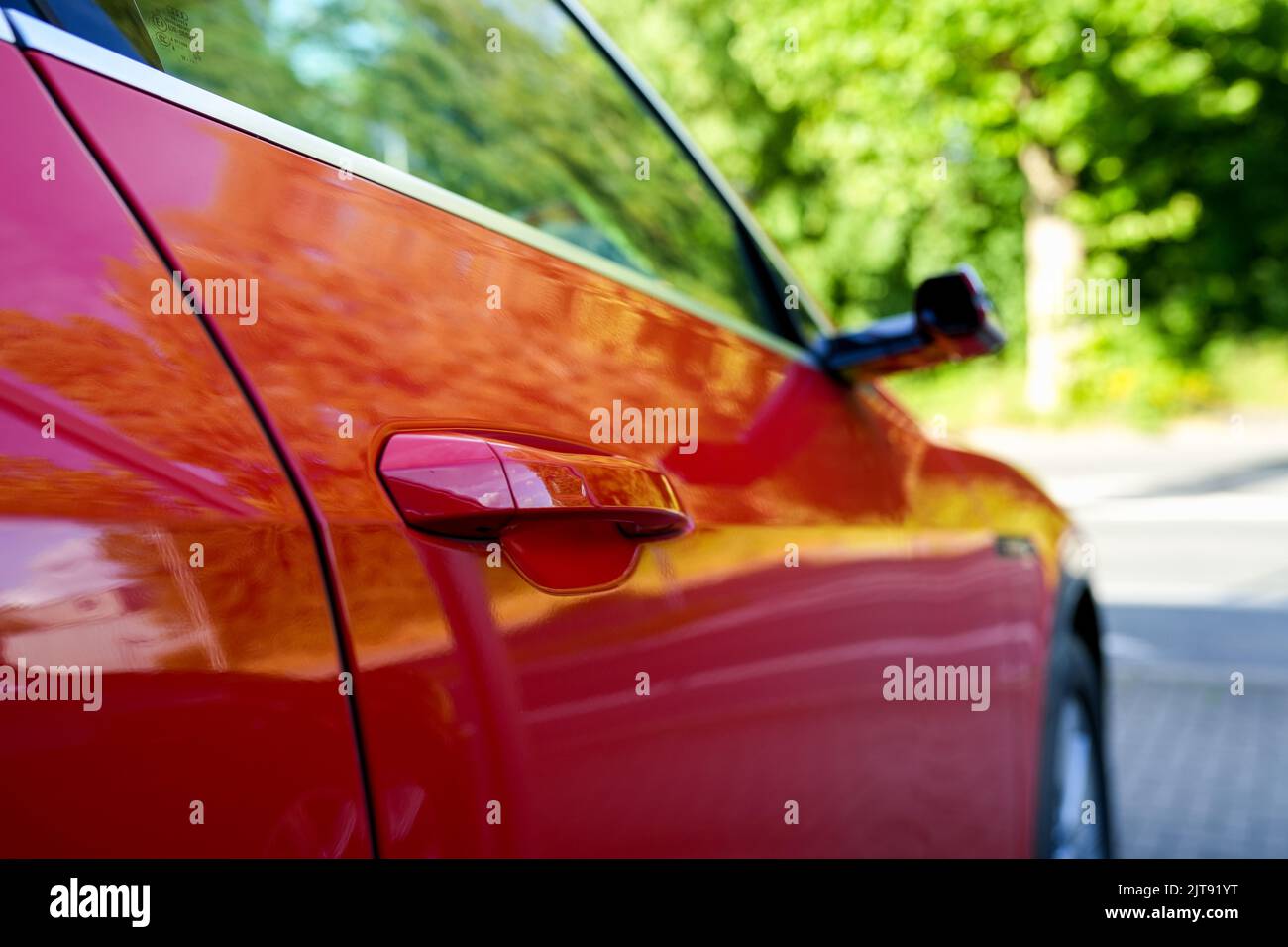 A side view of red car with handle Stock Photo - Alamy