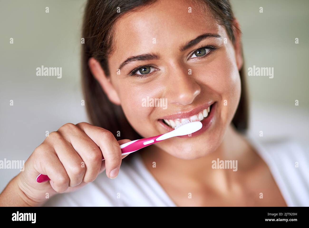 Healthy white teeth are her reward. Portrait of a beautiful woman ...