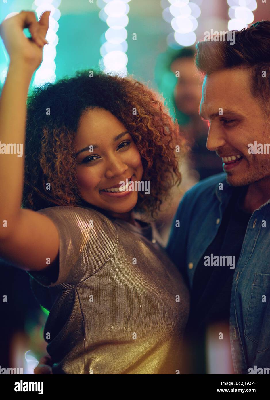 Its hard to stand still when you feel the beat. a young couple having ...