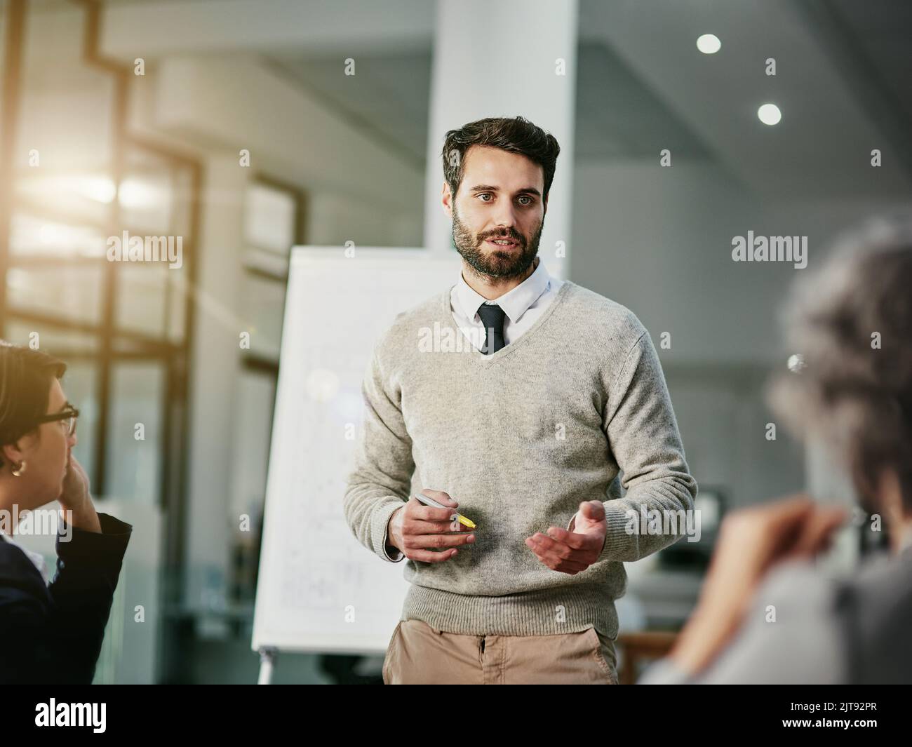 Reporting back on their business stats so far. a young businessman ...