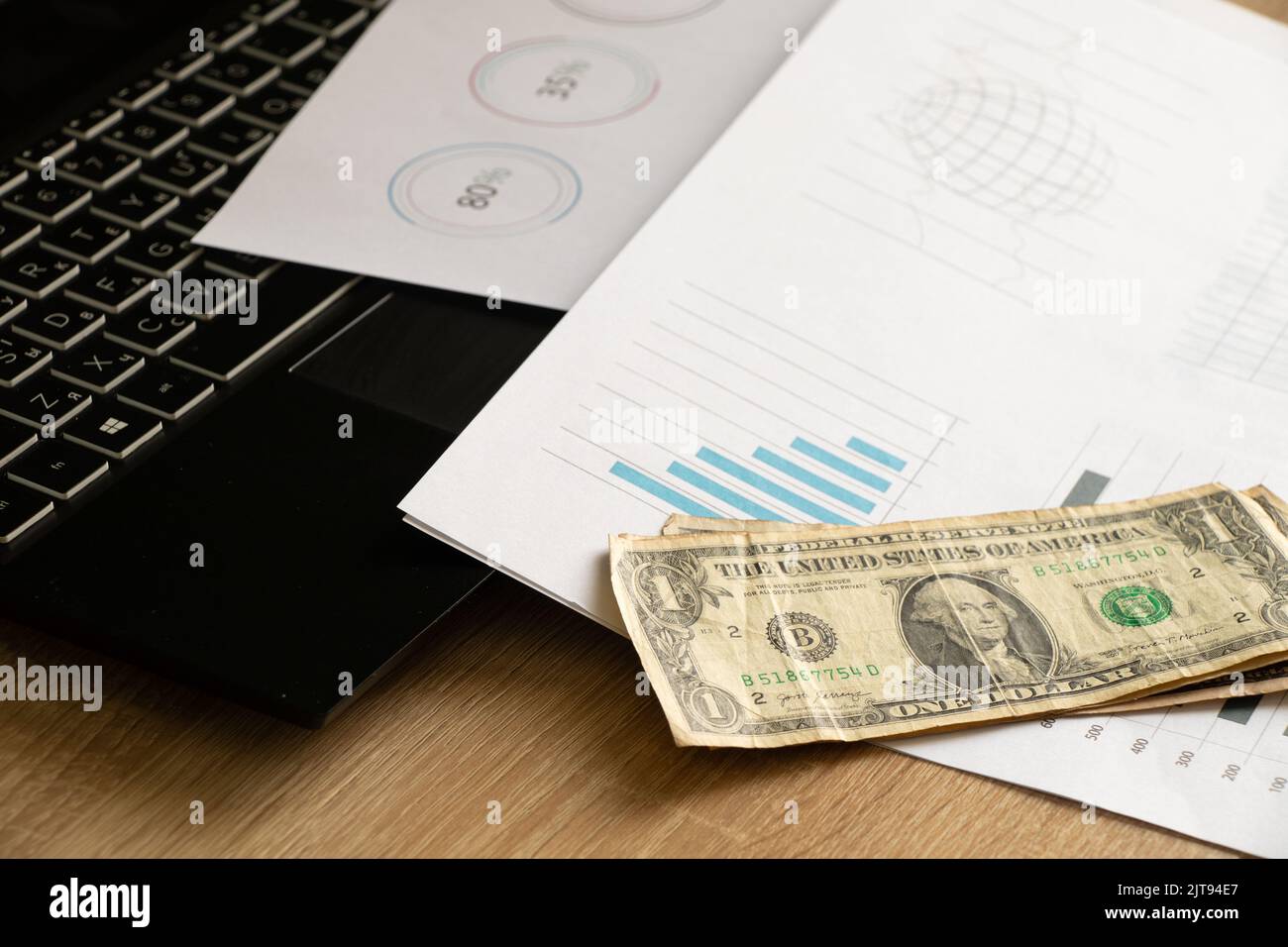 reports and histograms on paper on the table, analytics and statistics ...