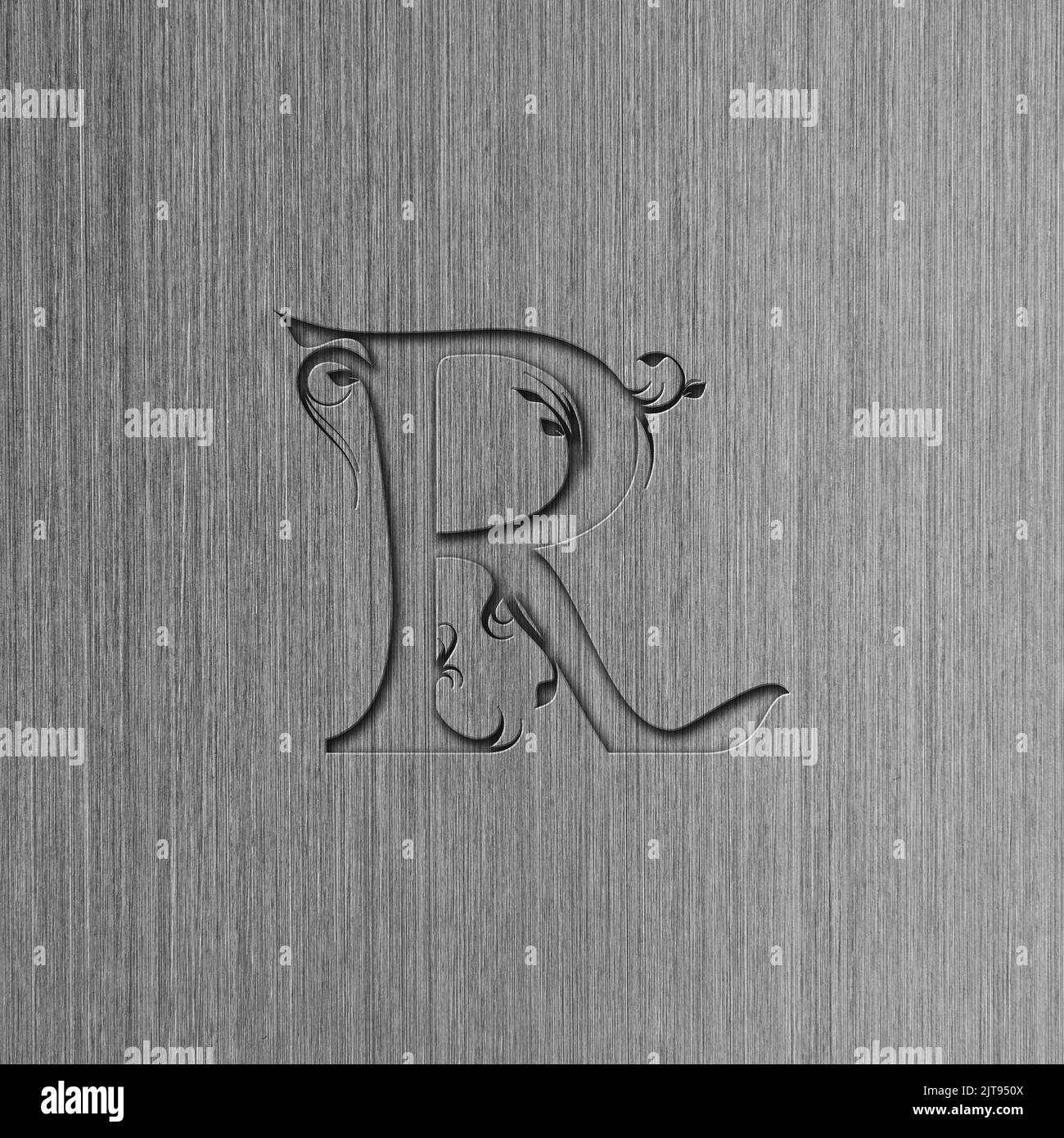 Macro shot of brushed steel with the letter R, metal texture background ...