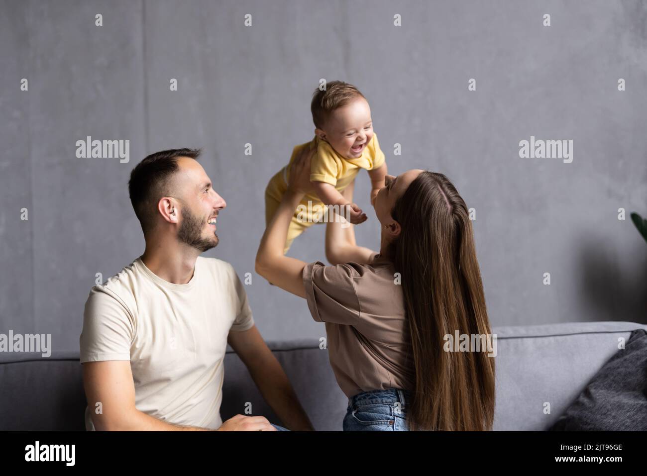 Happy family and kid son having fun at home Stock Photo - Alamy