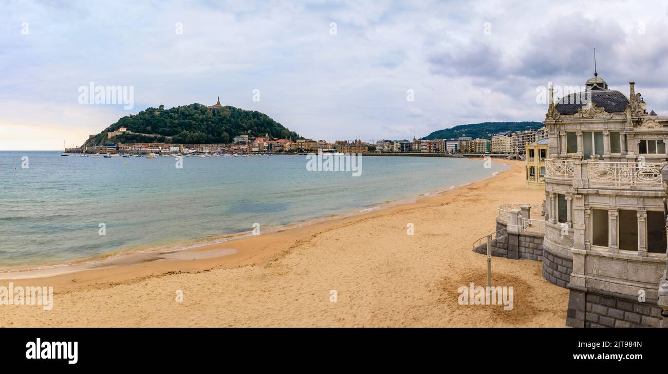 Panoramic view of La Concha bay, beach and waterfront buildings, mount ...