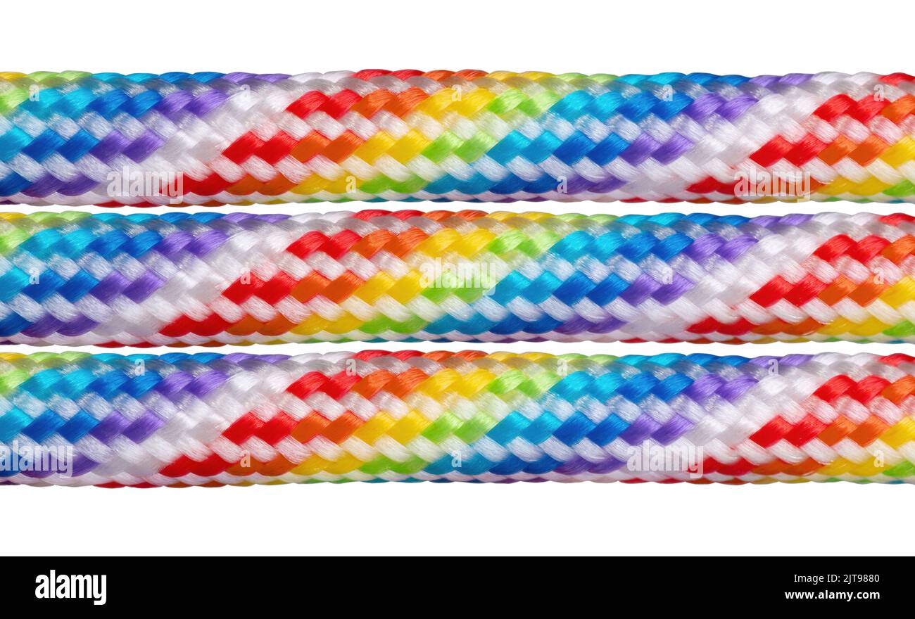 Three rainbow colored braided cotton cords isolated on white background ...