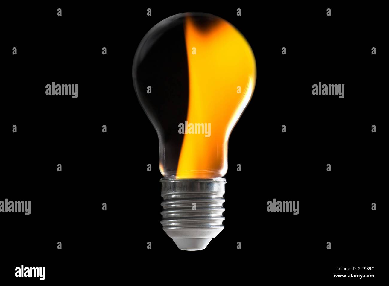 Flame tongues inside an incandescent light bulb isolated on black ...