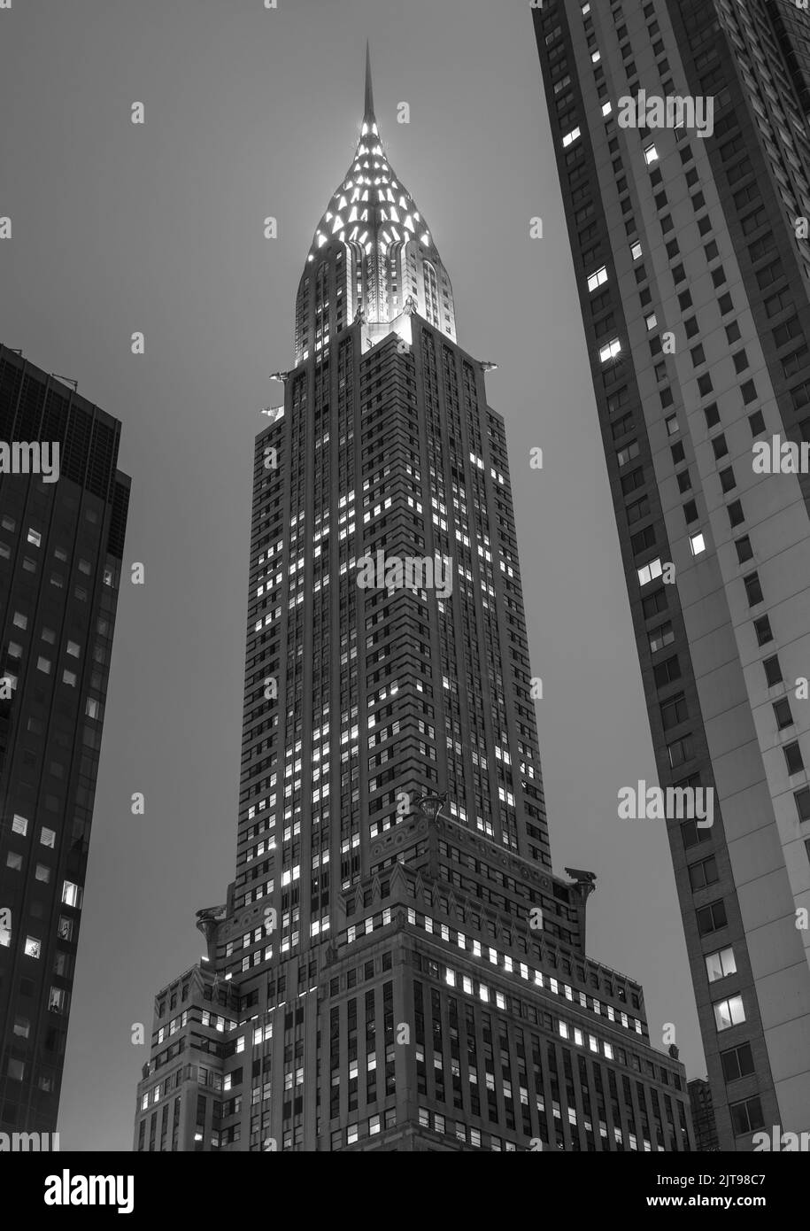 A black and white night-time view of the Chrysler Building in Midtown ...