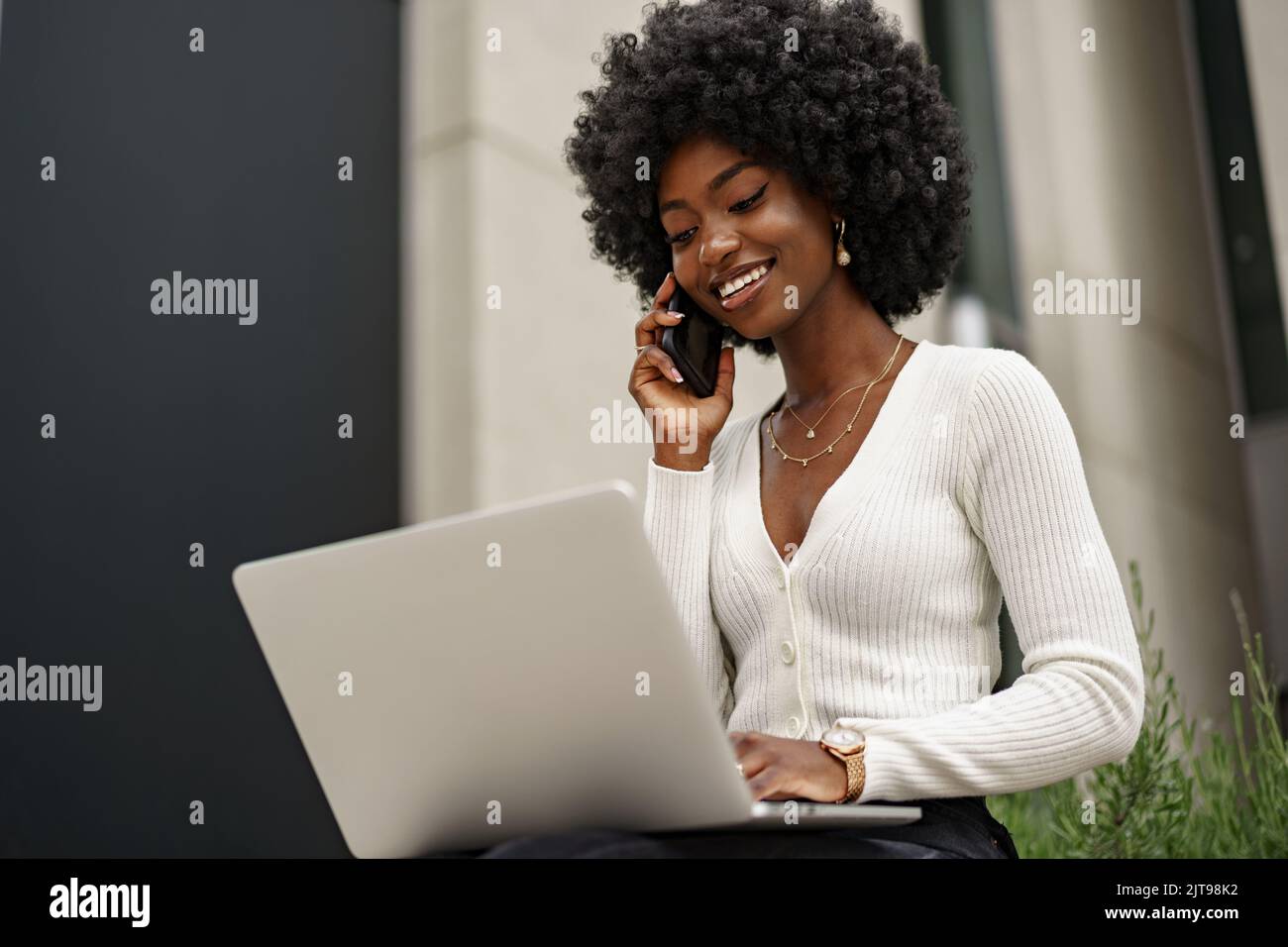 Young african american businesswoman working using laptop sitting on ...