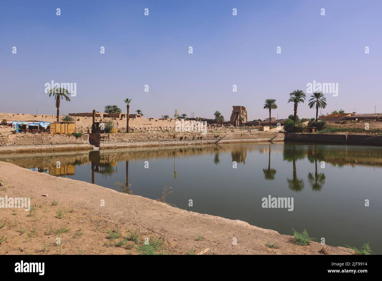 Ancient Lake in the Karnak Temple Complex with the Palm Trees around ...