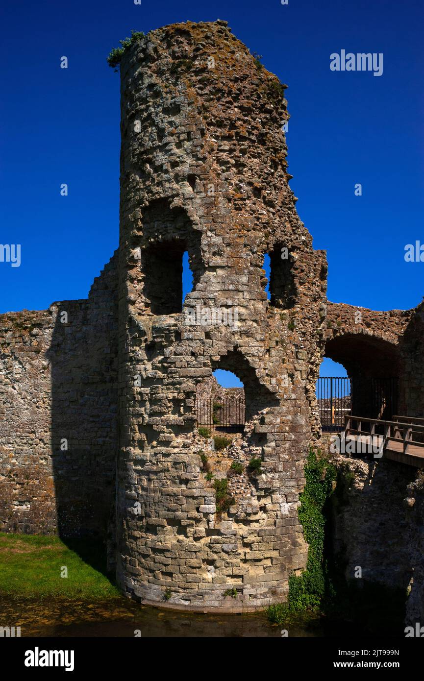 Deep blue sky seen through gaping holes in 13th century gatehouse tower ...