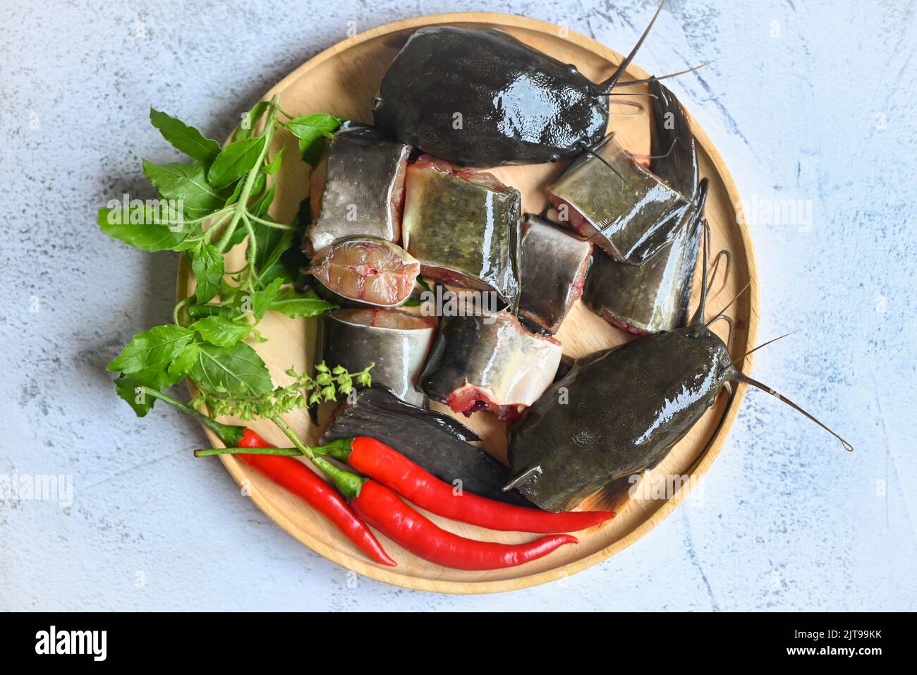 catfish for cooking food, fish chopped with ingredients herb and spices ...