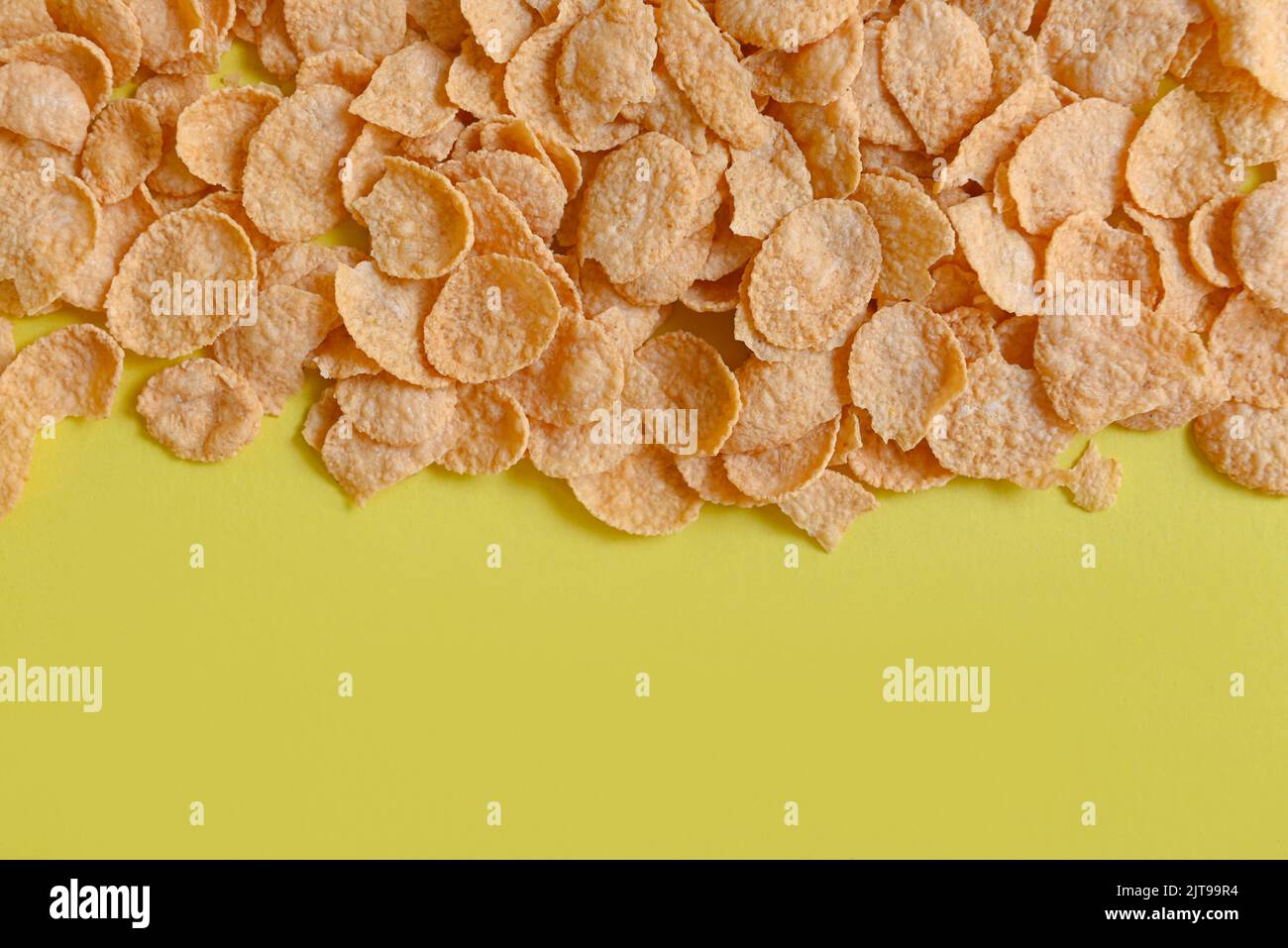 Cornflakes on yellow background, cornflakes breakfast food and snack ...