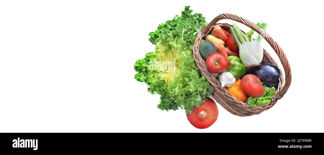 view above a basket full of fresh and varied vegetables isolated on ...