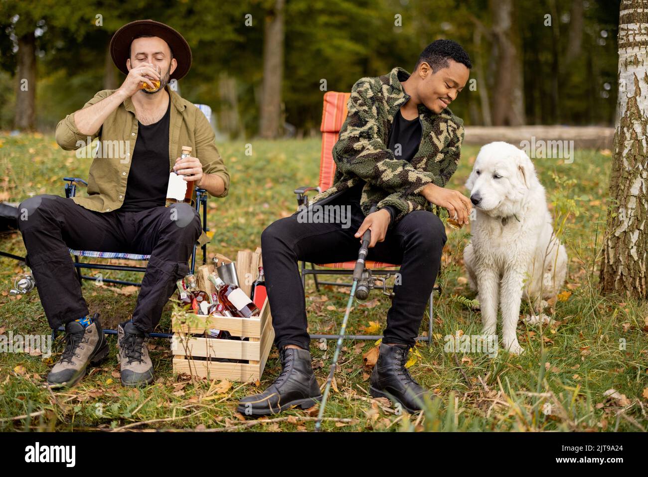 Men drinking alcohol while fishing Stock Photo - Alamy