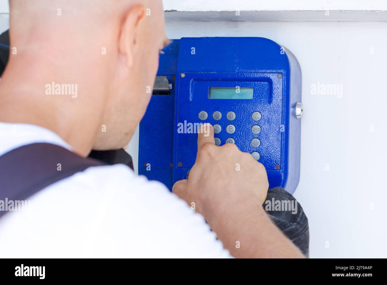 Man using payphone hi-res stock photography and images - Alamy