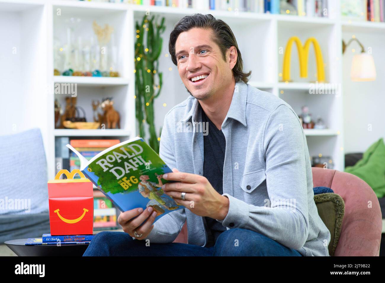 EDITORIAL USE ONLY Vernon Kay reading a book, as the presenter has ...