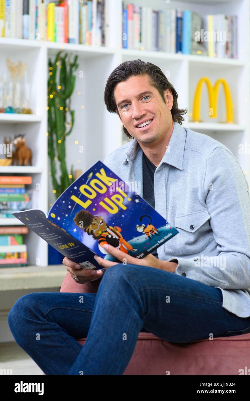 EDITORIAL USE ONLY Vernon Kay reading a book, as the presenter has ...