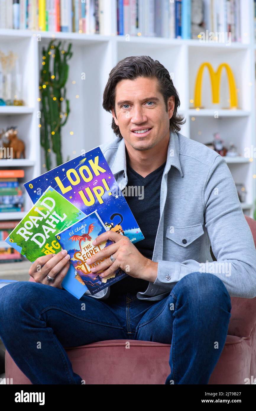 EDITORIAL USE ONLY Vernon Kay reading a book, as the presenter has ...