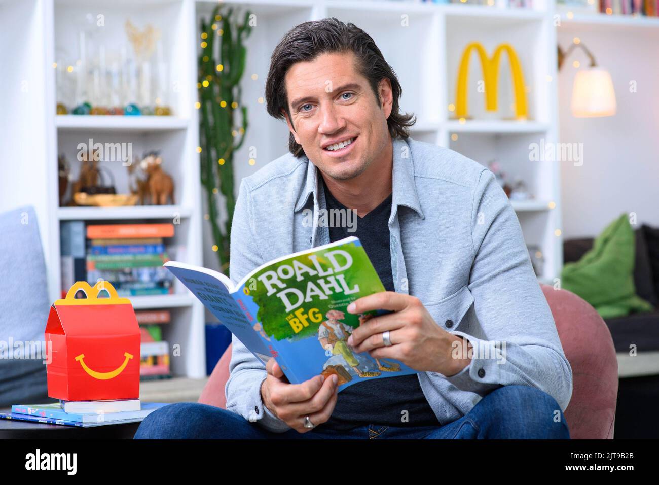 EDITORIAL USE ONLY Vernon Kay reading a book, as the presenter has ...
