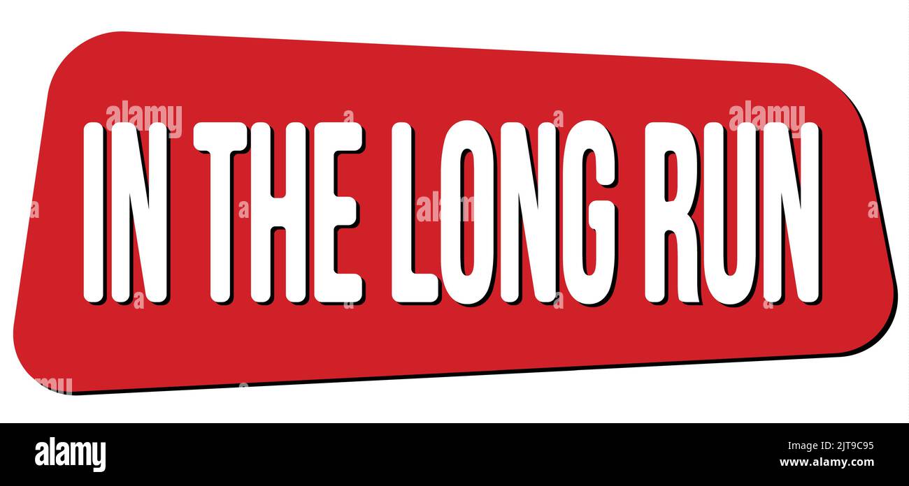 IN THE LONG RUN text written on red trapeze stamp sign Stock Photo - Alamy