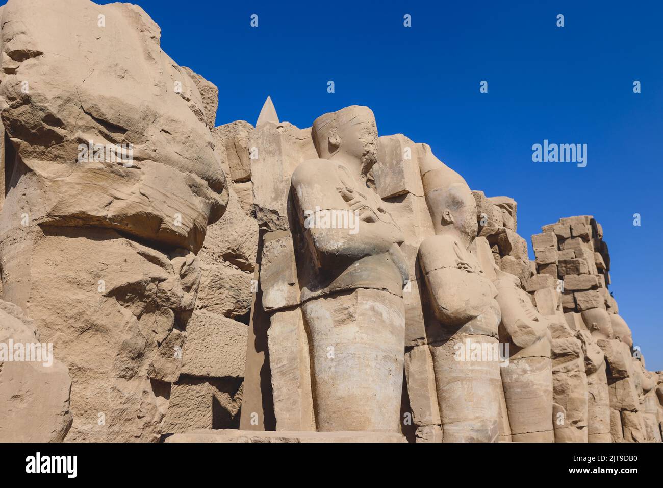 Ancient Sandstone Ruins of Old Egyptian God in the Karnak Temple ...