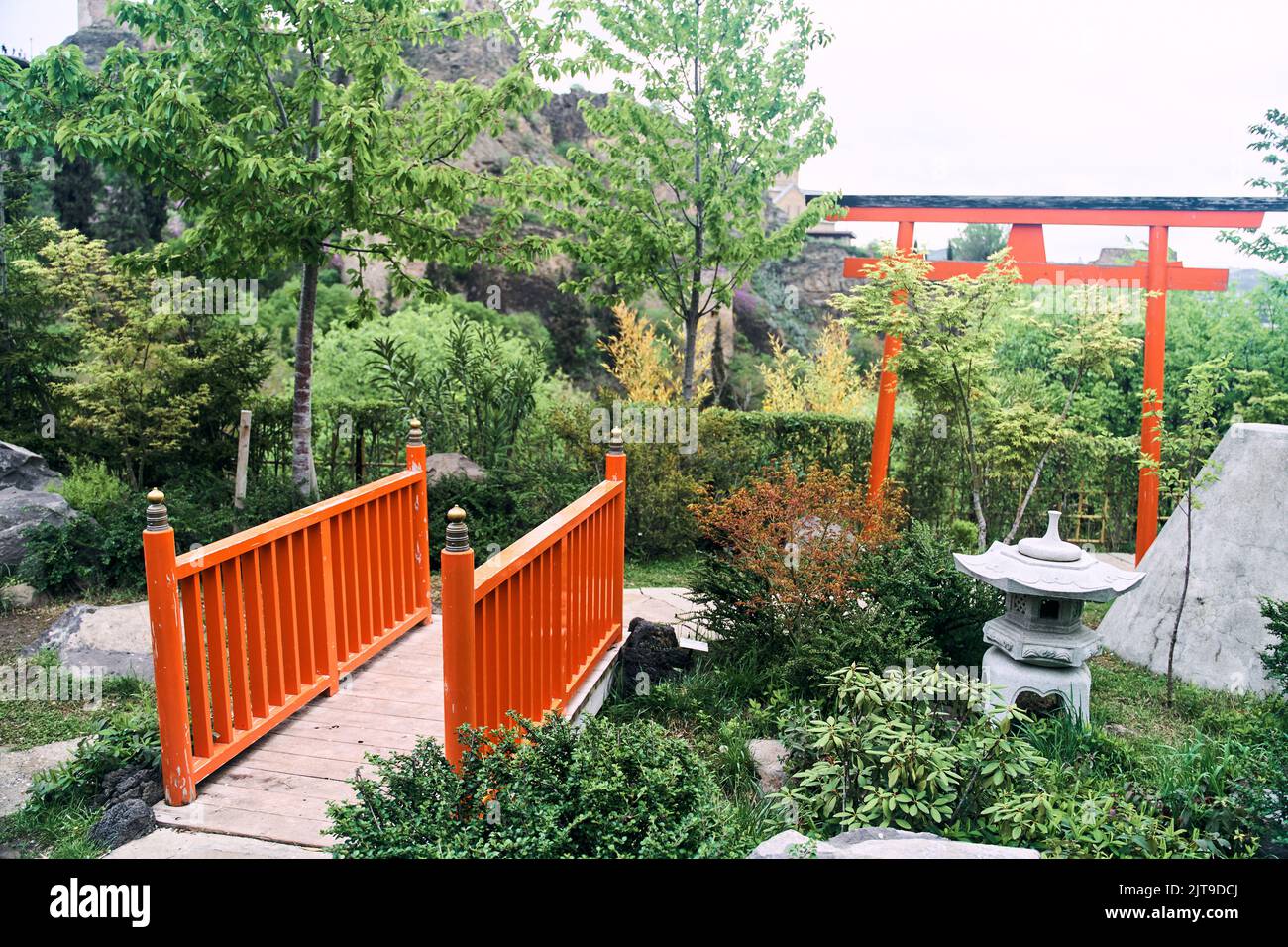 Red bridge in the Japanese park in the botanical garden in Tbilisi Stock Photo - Alamy
