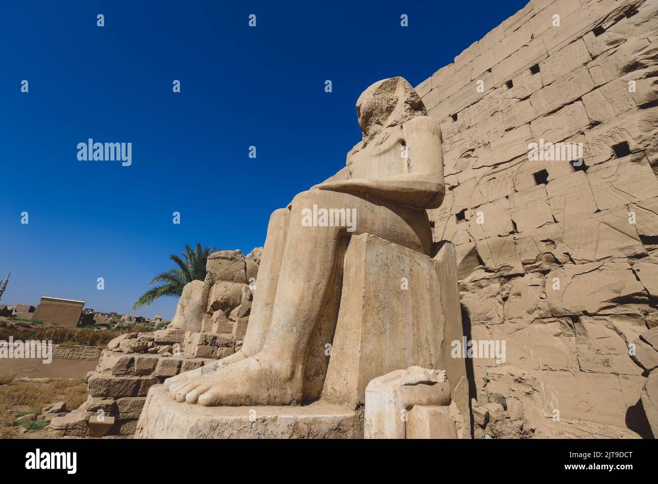 Ancient Sandstone Ruins of Old Egyptian God in the Karnak Temple ...