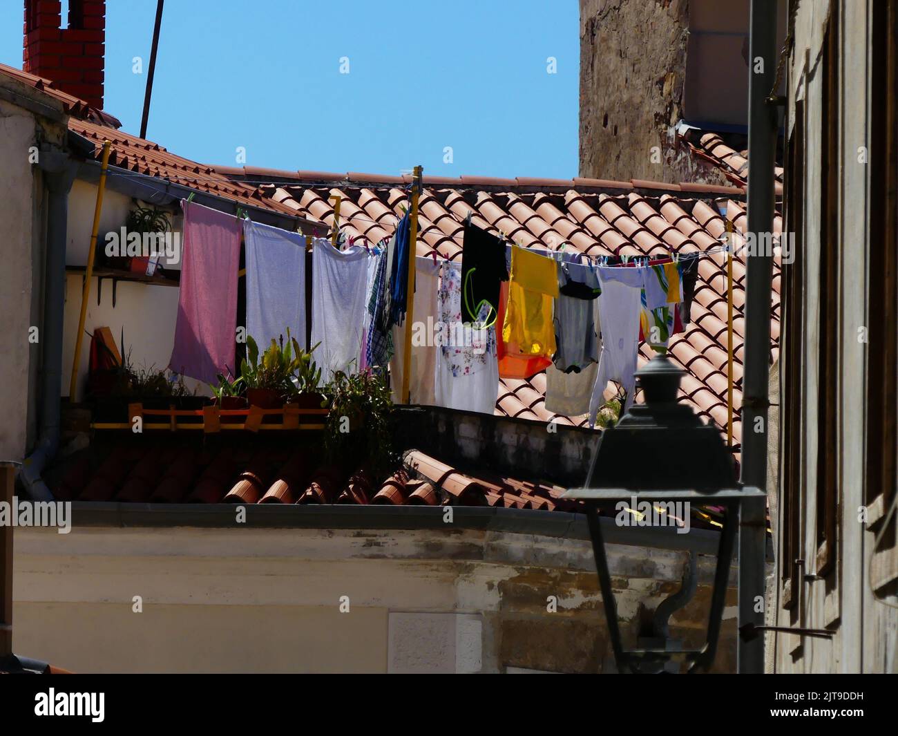 A beautiful shot of a hanging laundry for drying on house balcony Stock ...