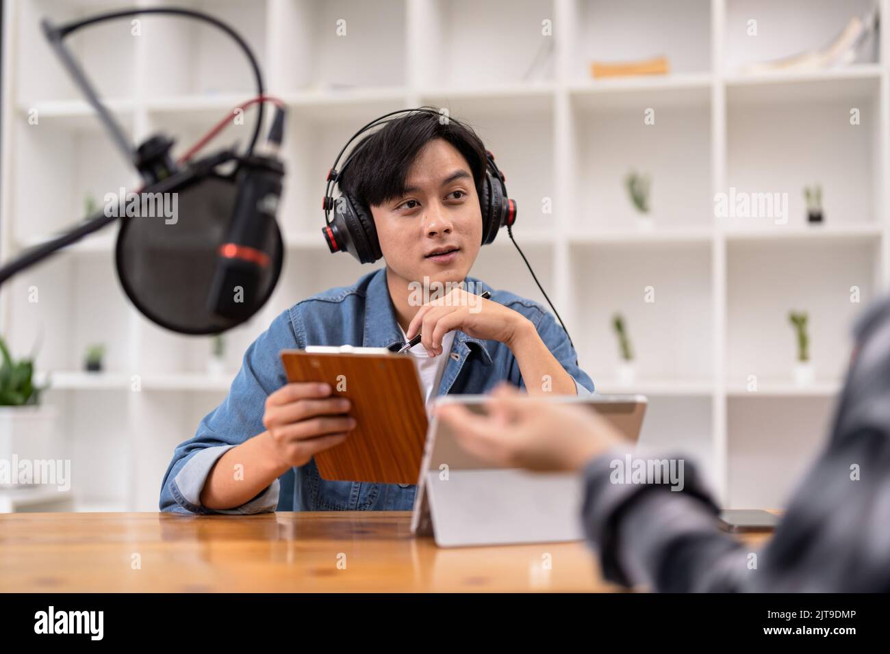 Online podcast host recording interview hi-res stock photography and ...