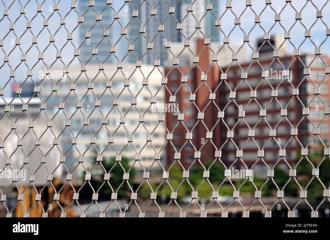 The skyline of Boston, MA, seen through a metal fence Stock Photo - Alamy